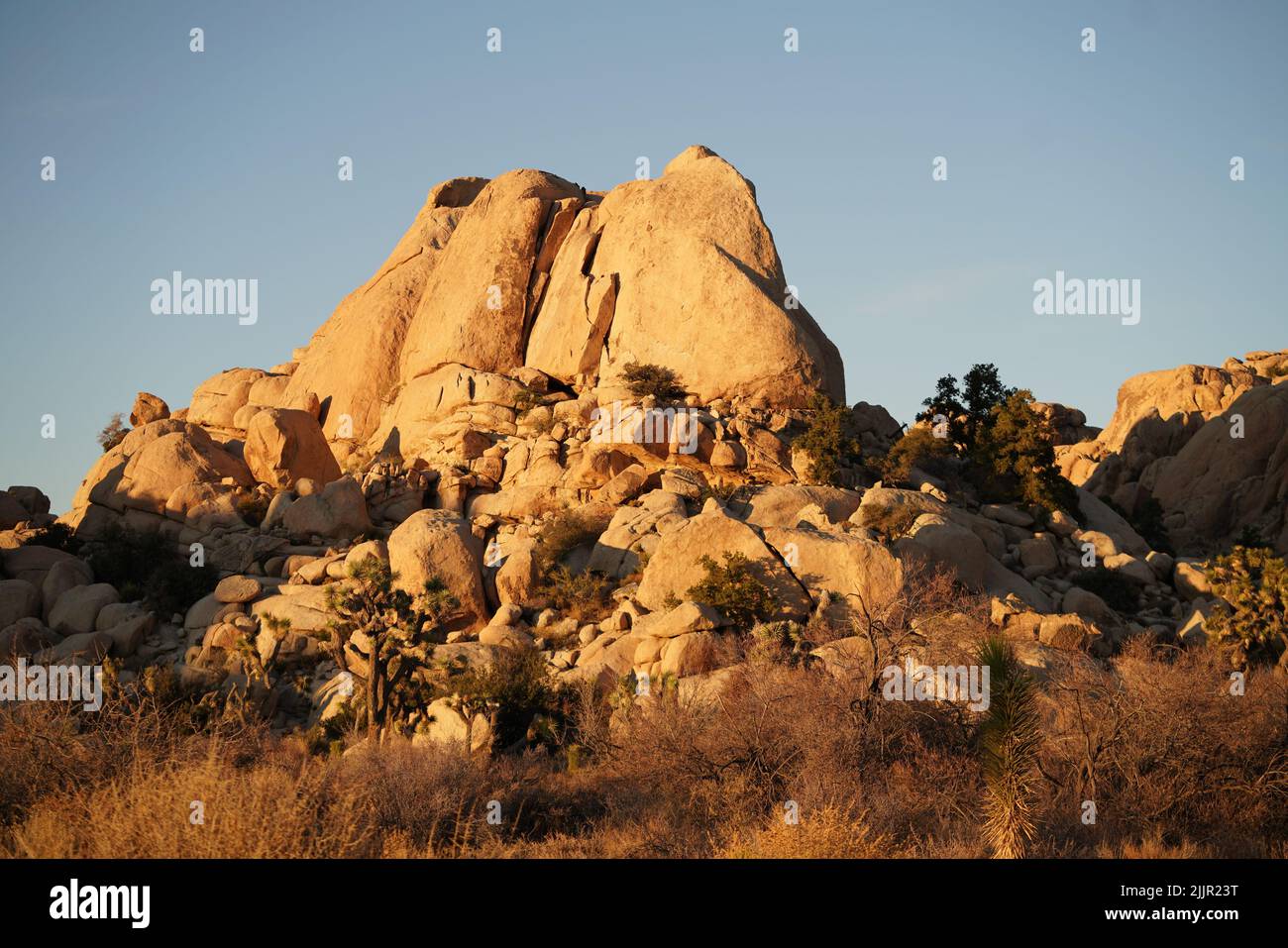 The rock formations with small pieces of rock against the blue clear ...