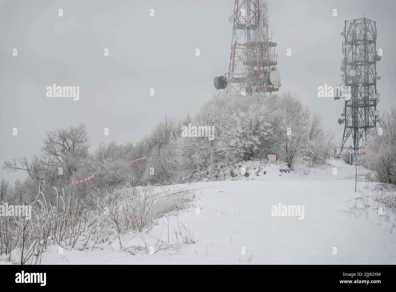 Two base stations surrounded by leafless trees in the wintertime Stock ...
