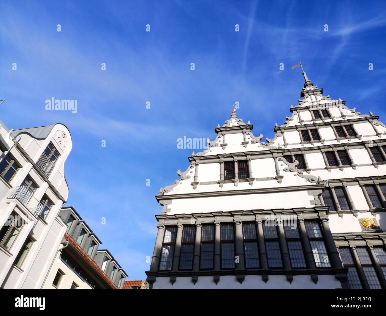 The historic town hall and facades of old merchant houses in the old ...