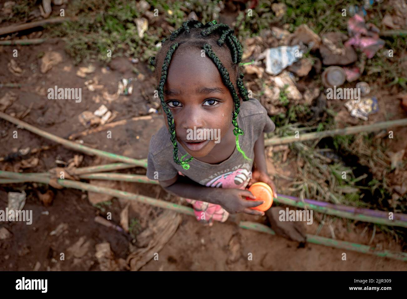 A portrait of a young girl in Kibera Slum, Nairobi. Life inside Kibera ...