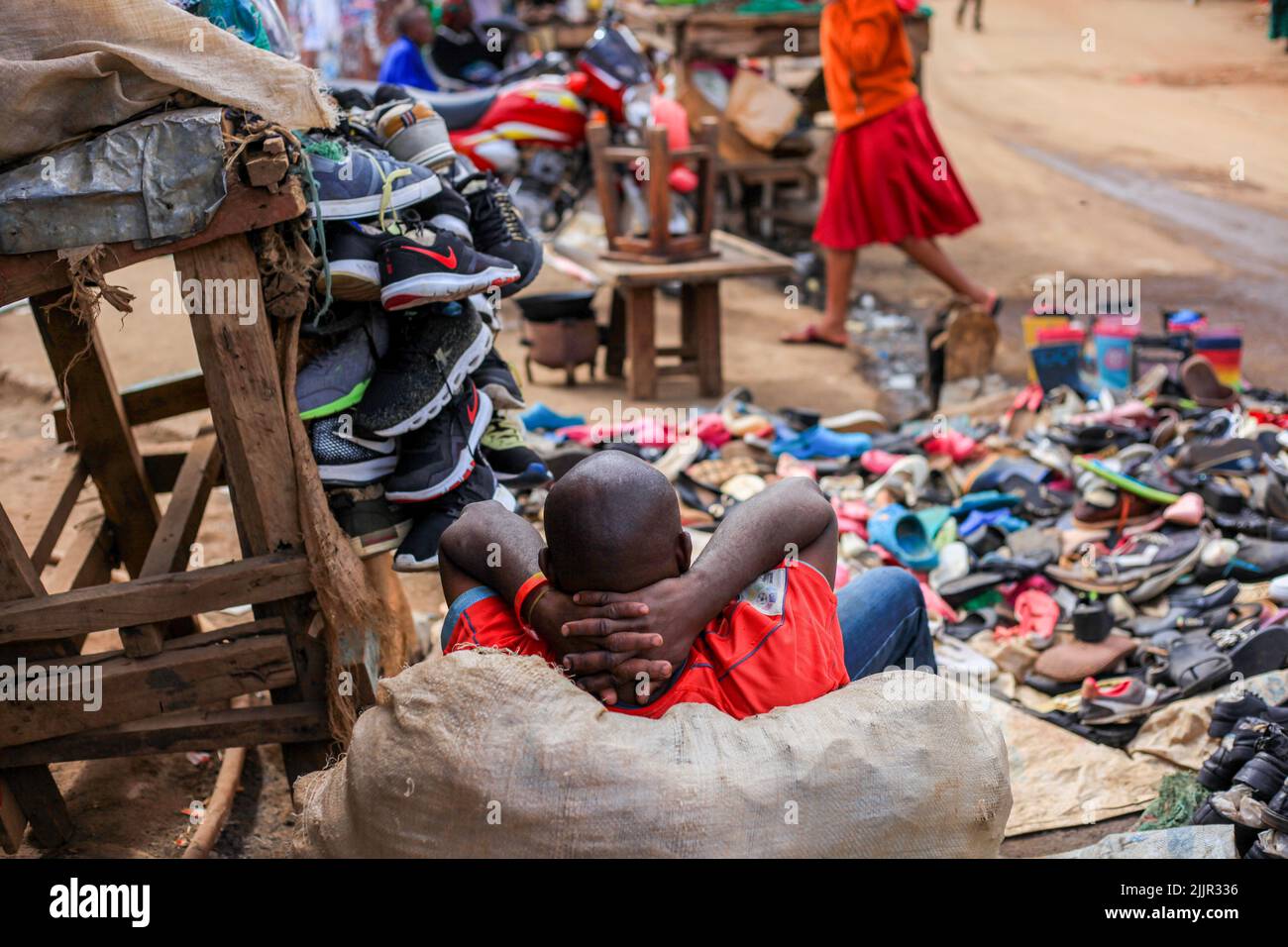 A shoe vendor waiting for buyers in Kibera Slum, Nairobi. Life inside ...
