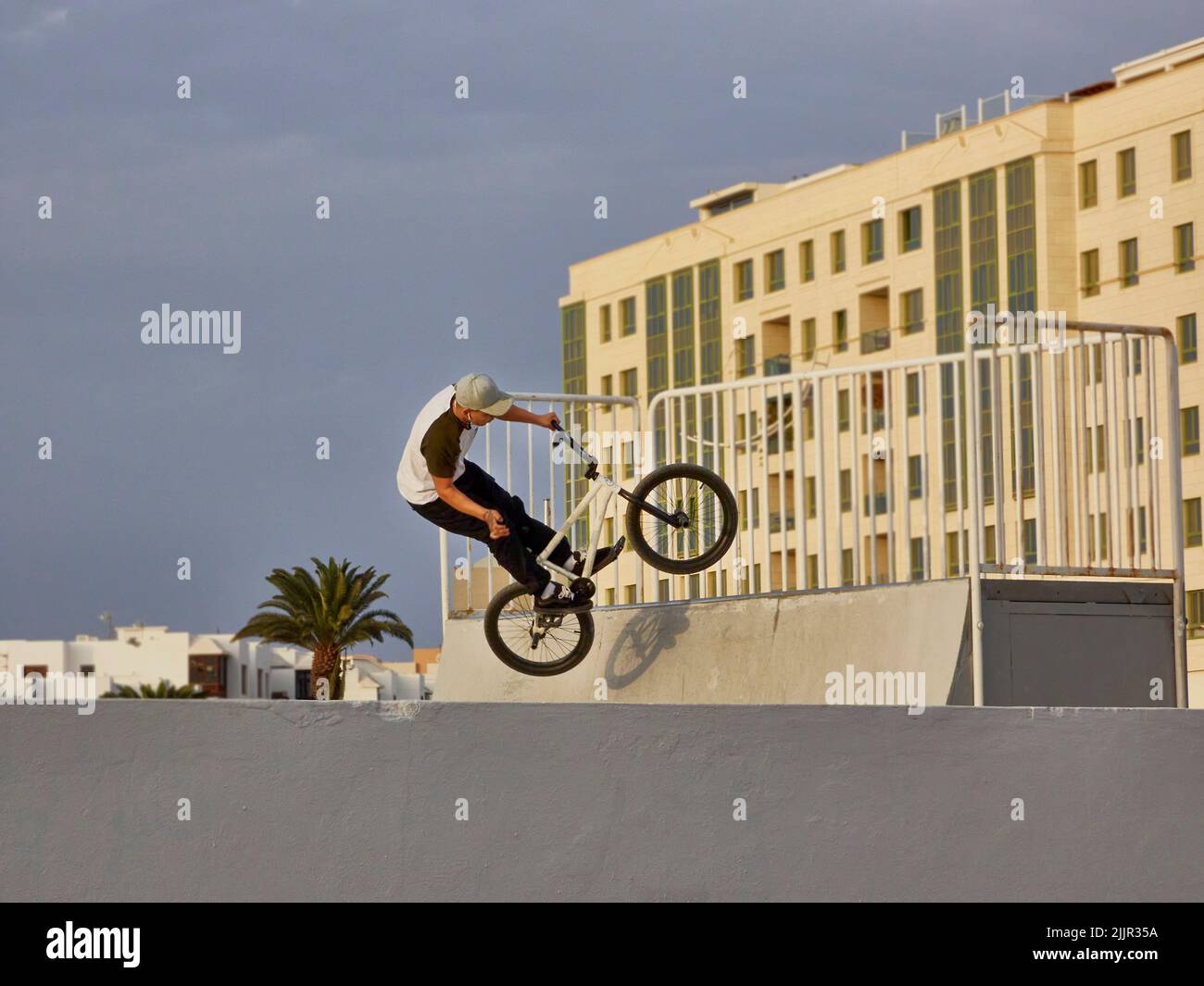A freestyle bike rider stunt above an outdoor ramp Stock Photo - Alamy