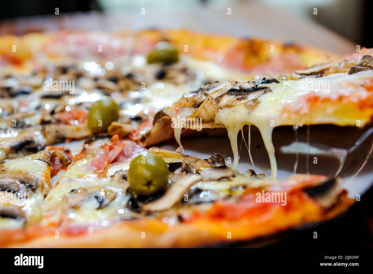 Pizza cheesy slice hi-res stock photography and images - Alamy