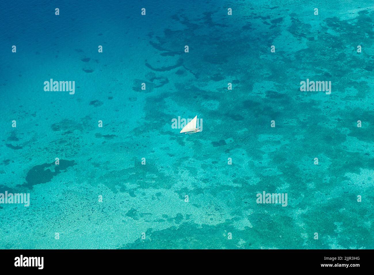 Birds eye view on a wooden sailboat on open sea. Dhow. Faluka. Zanzibar ...