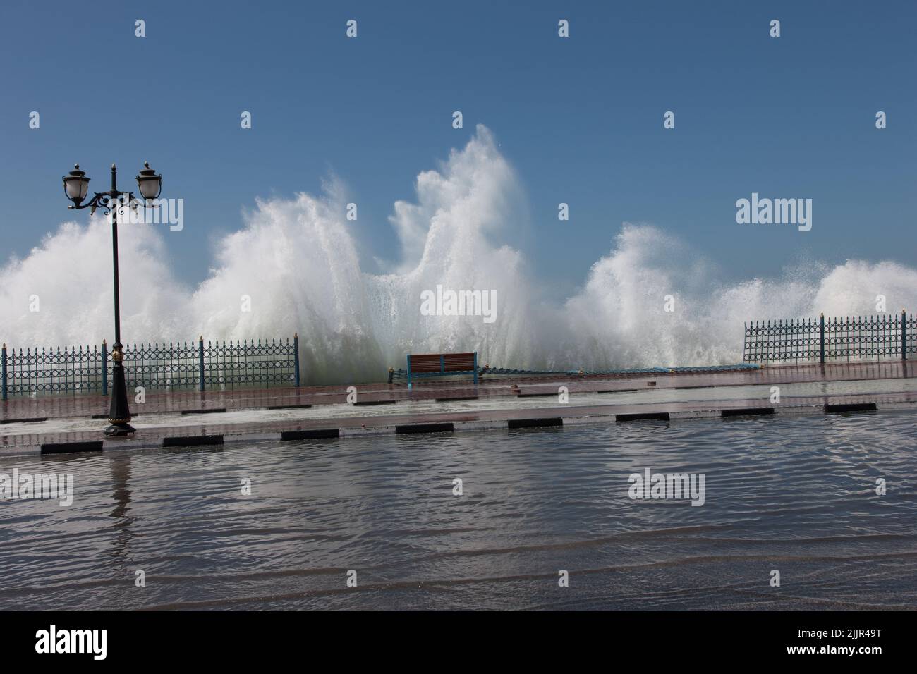Promenade damage during sea storm in the winter in UAE. Overflowing ...