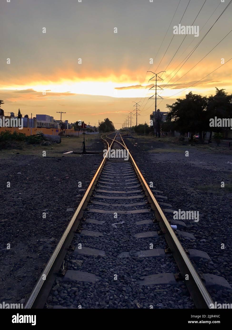 Railroad tracks in the setting sun, train tracks at sunset Stock Photo ...