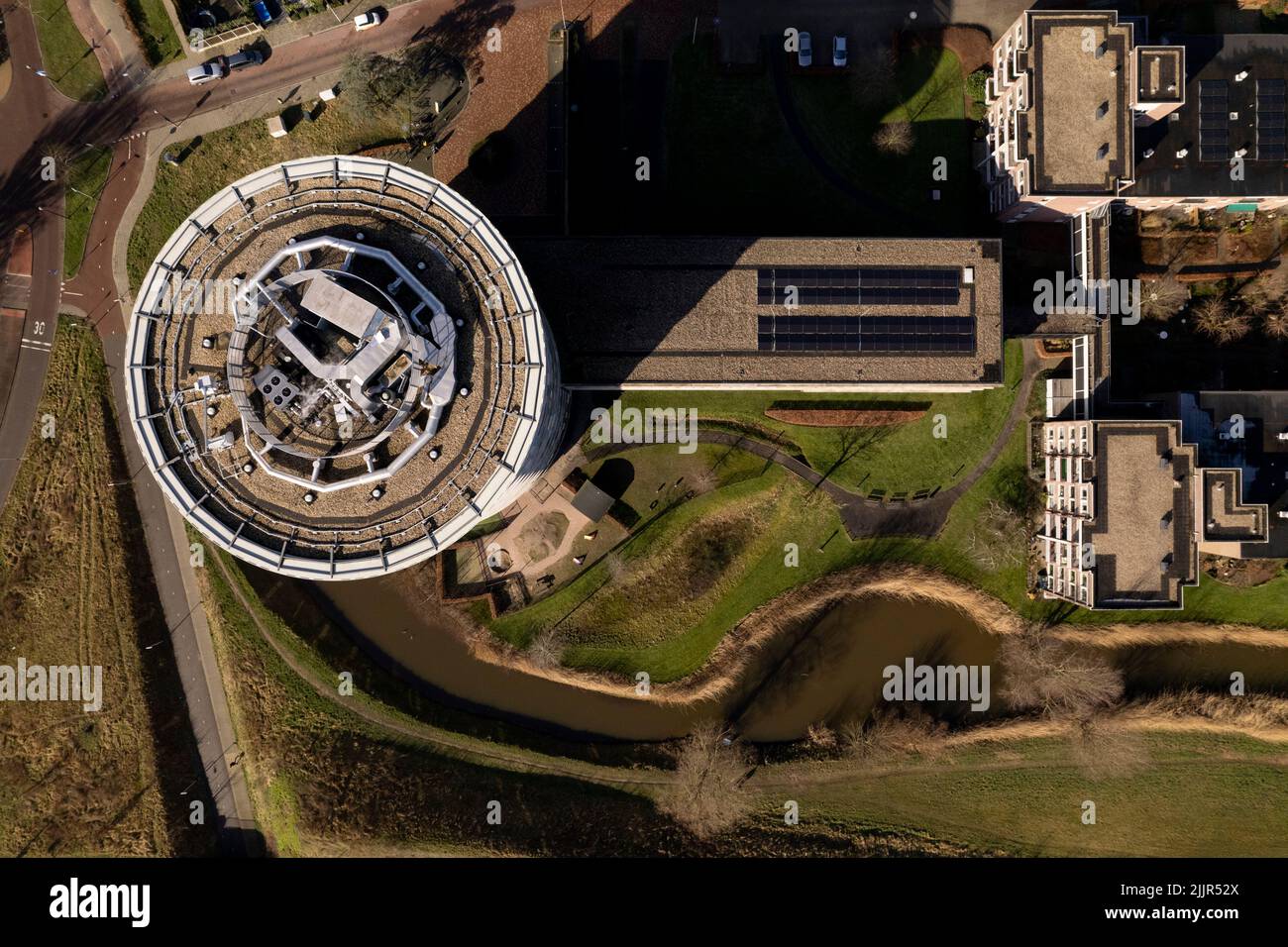 Top down aerial view of Polbeek service flat round tower with park ...