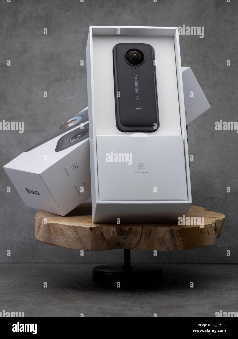 Opened up Insta360 new package camera box on a wooden display stand ...