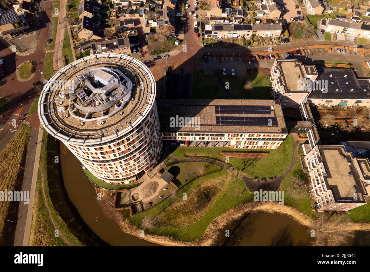 Top down aerial view of Polbeek service flat round tower with park ...