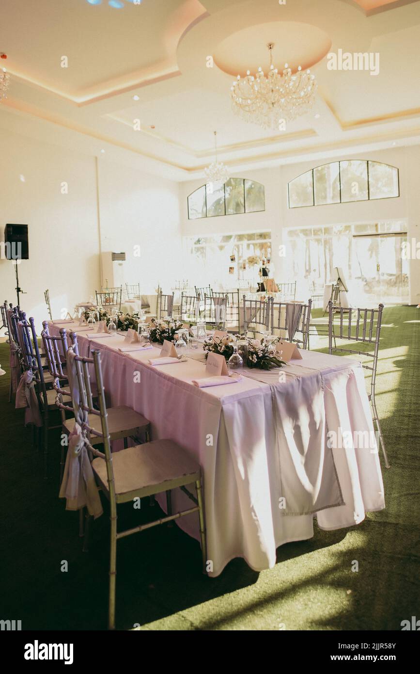 A vertical shot of the table with decorations an the restaurant for an ...
