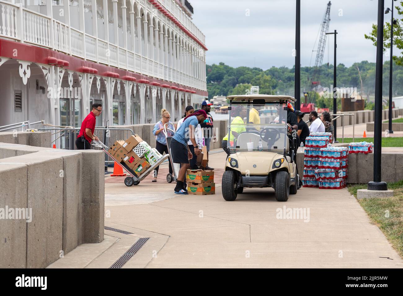 Crew members loading food and supplies on the American Countess ...
