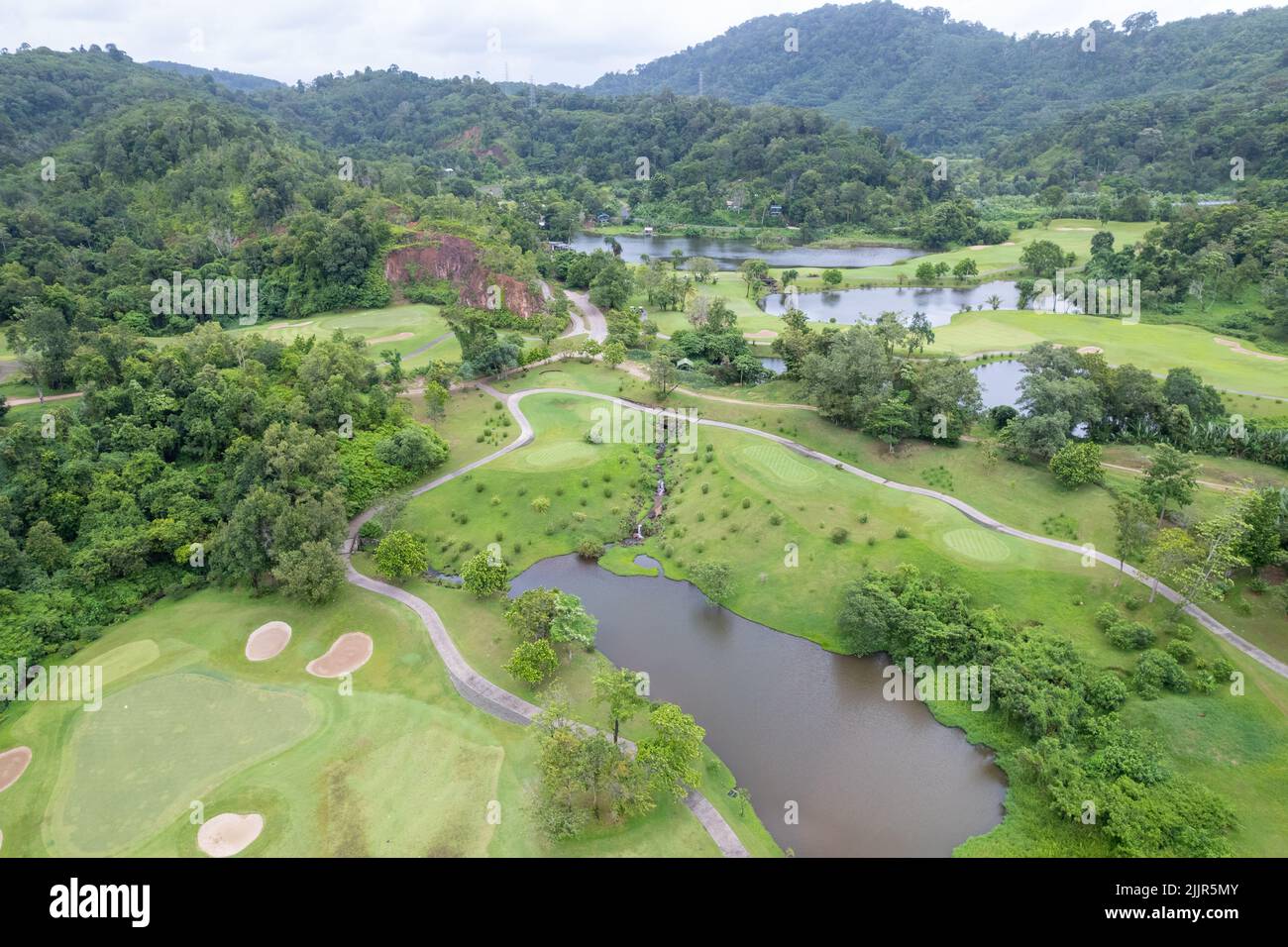 Aerial view drone shot of beautiful green golf field fairway and ...