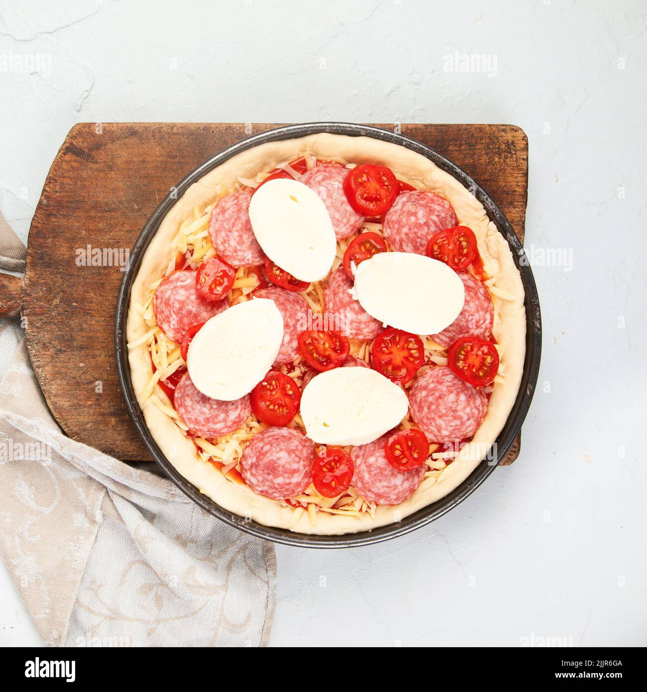 Pepperoni pizza on light background. Freshly made food. Top view, flat ...