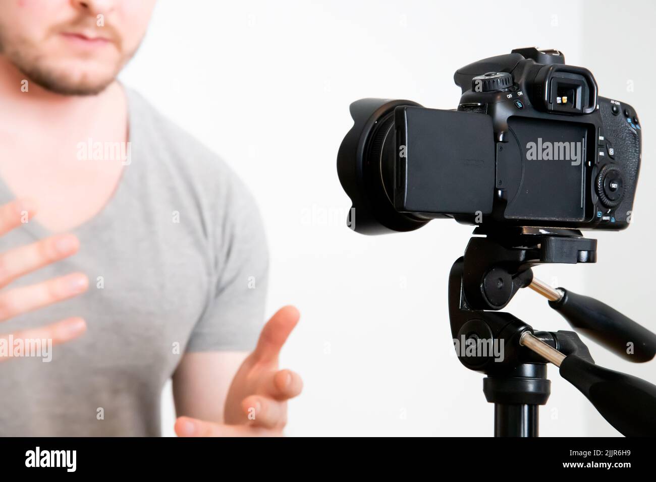 A male talking against a camera isolated on a white background Stock ...