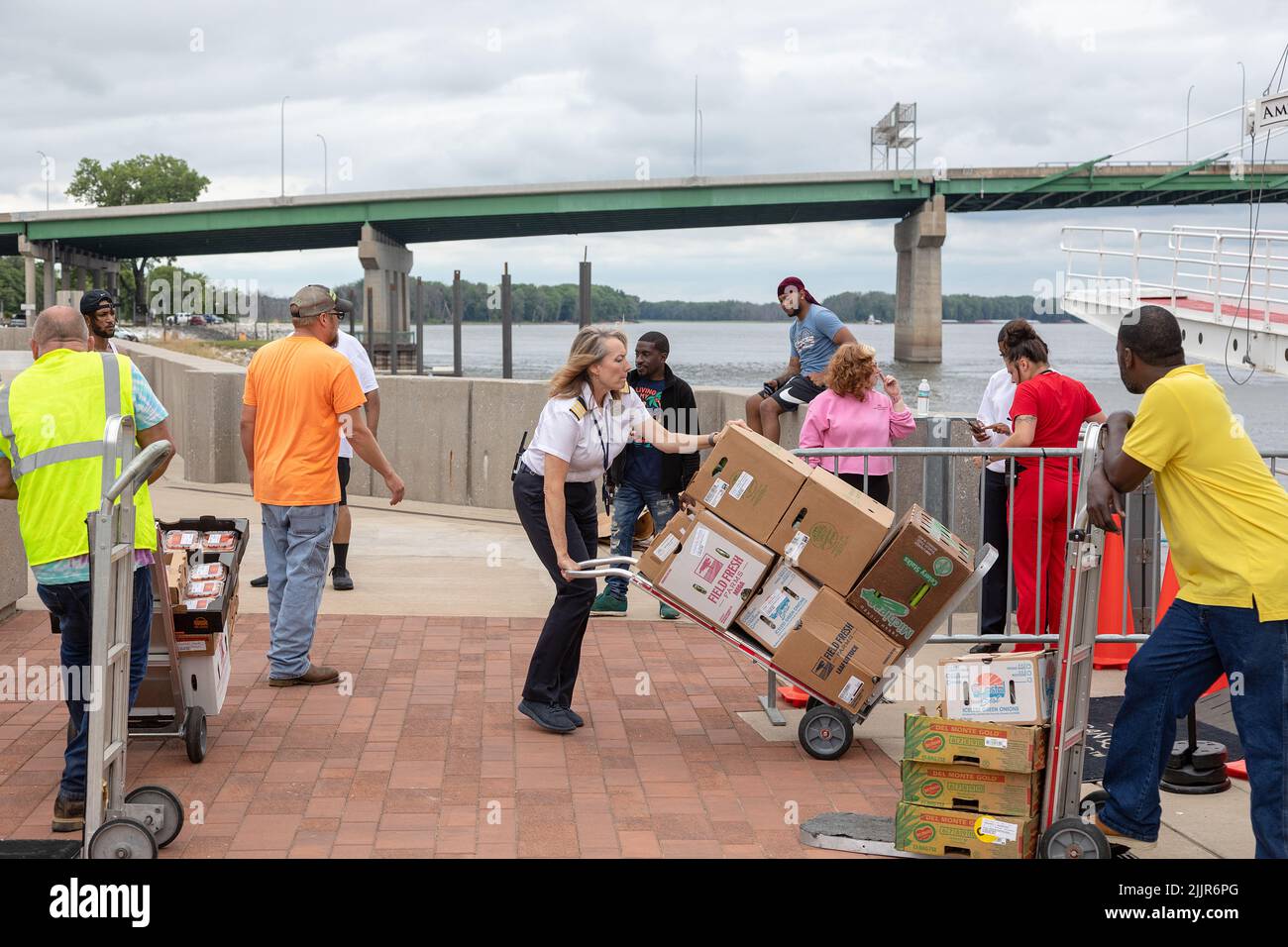 Crew members loading food and supplies on the American Countess ...