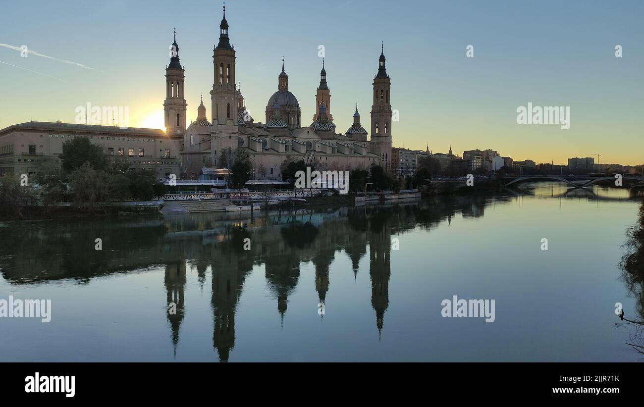 The Basilica of Our Lady of Pilar and Ebor River at sunset, Zaragoza ...