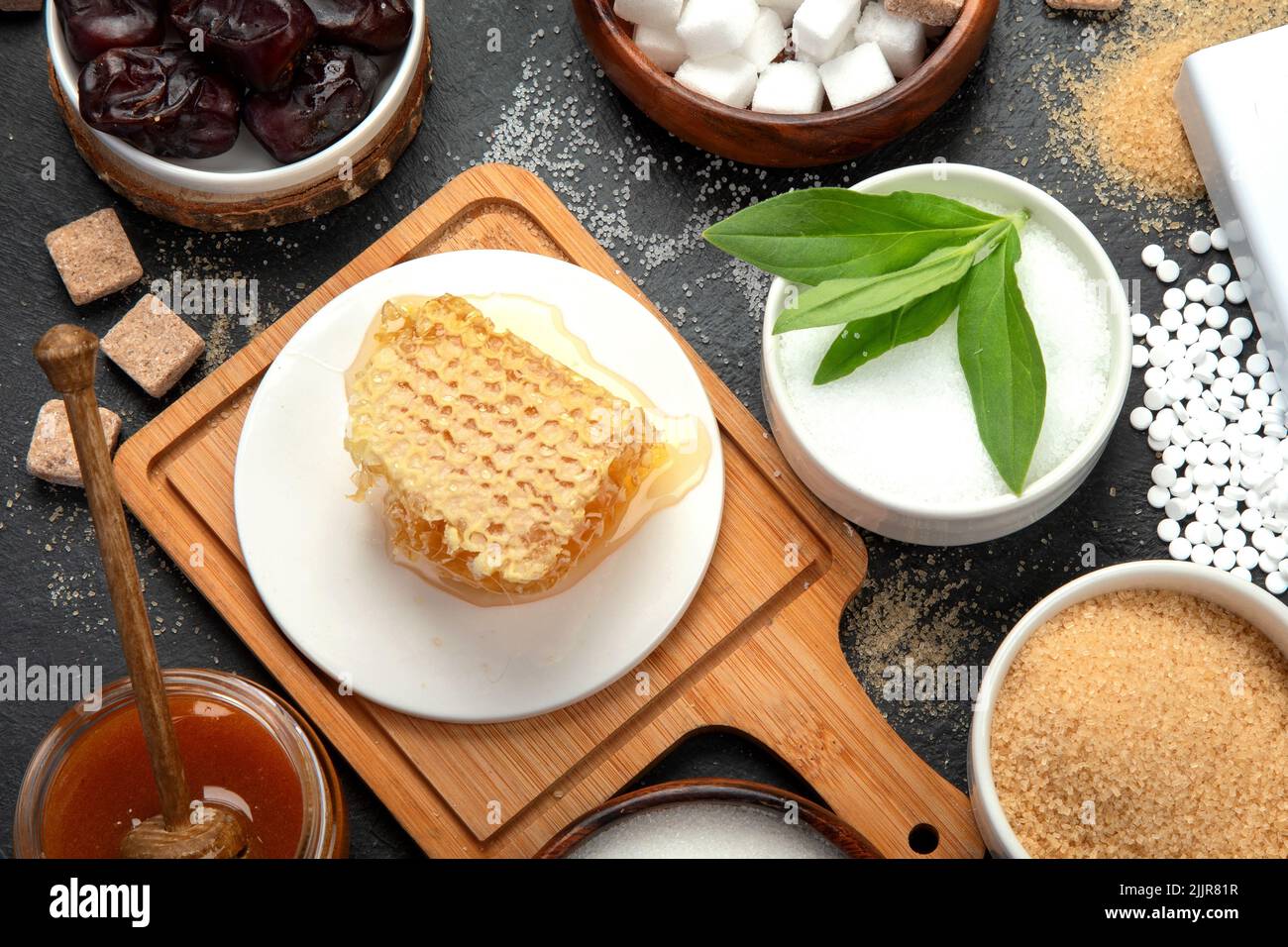 Various diet replacement for sugar on dark background. Organic ...