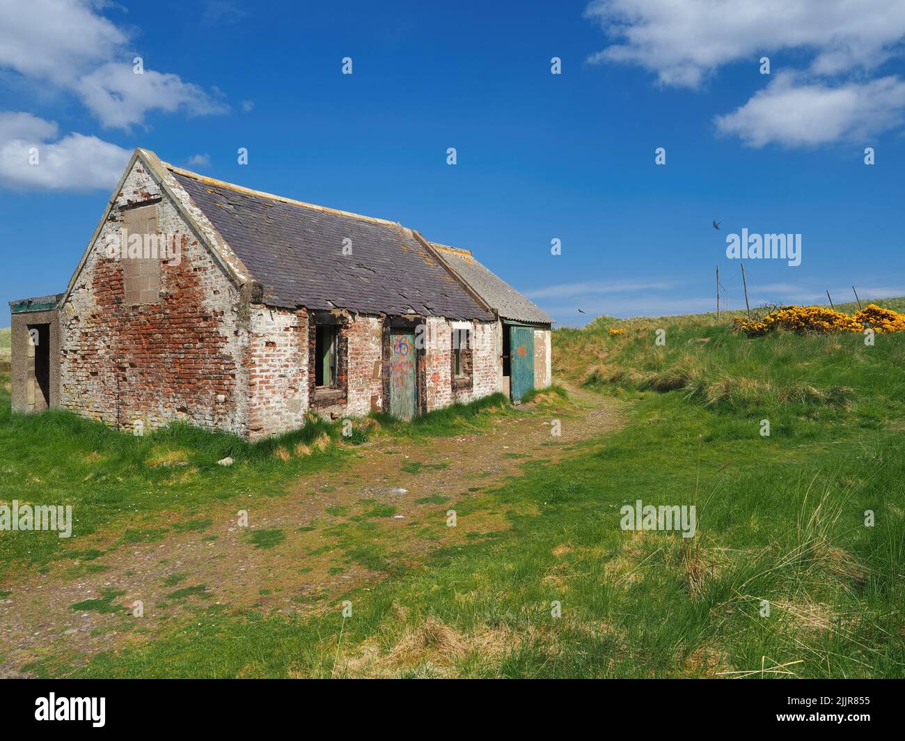 An abandoned beach shack in the early afternoon near Montrose, Scotland ...