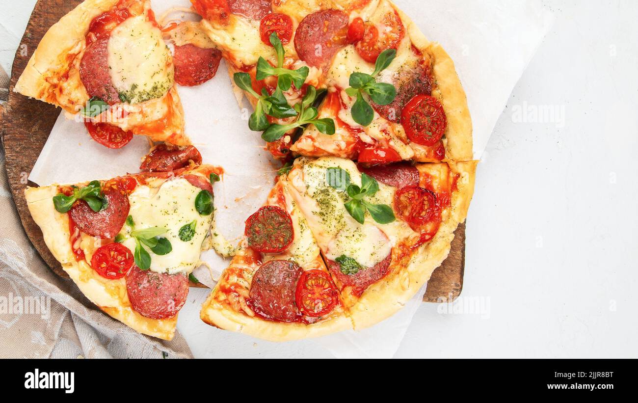 Pepperoni pizza on light background. Freshly made food. Top view, flat ...