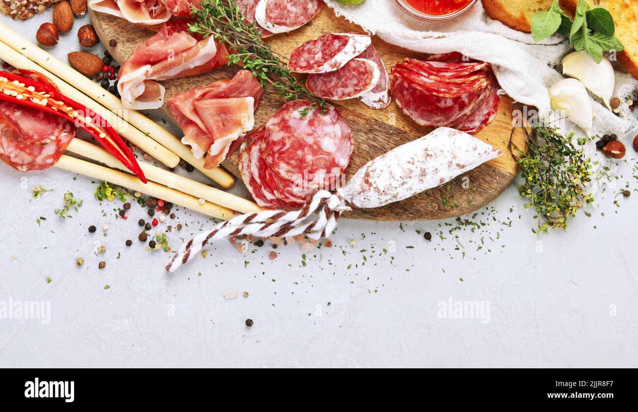 Sausages assortment on light background. Meat product made of finely ...
