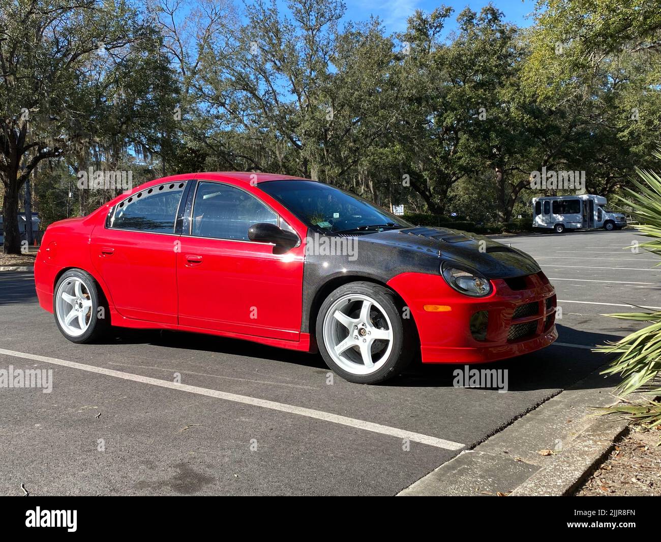 A Skittlefabz fully restored 2003 Dodge Neon SRT-4 in a parking lot ...