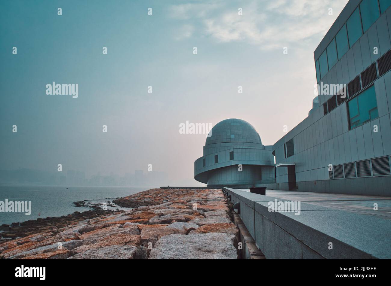 The Macau Science Center and a waterfront with a sky background, China ...