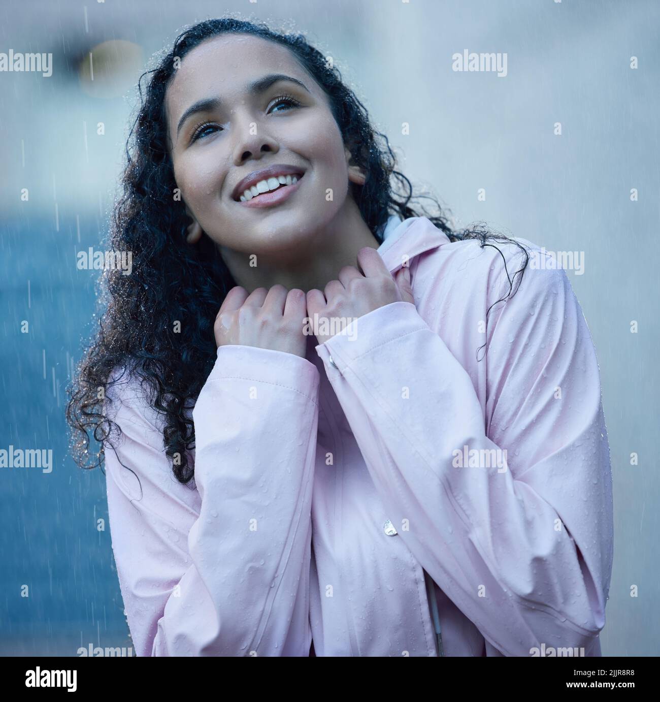 Every drop soothes my soul. a beautiful young woman looking thoughtful ...