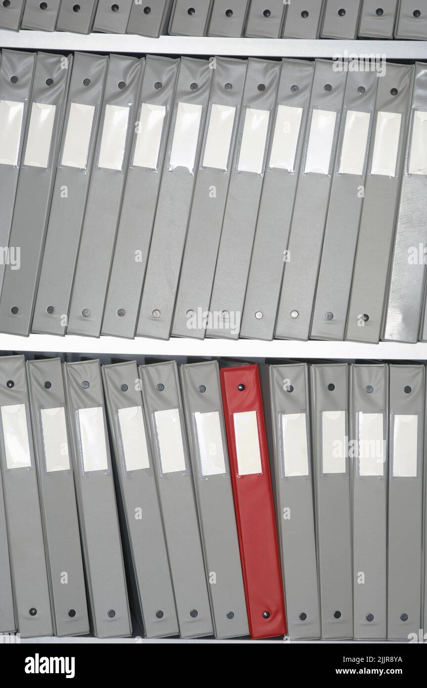 A vertical semi-grayscale shot of archival storage of documents Stock ...