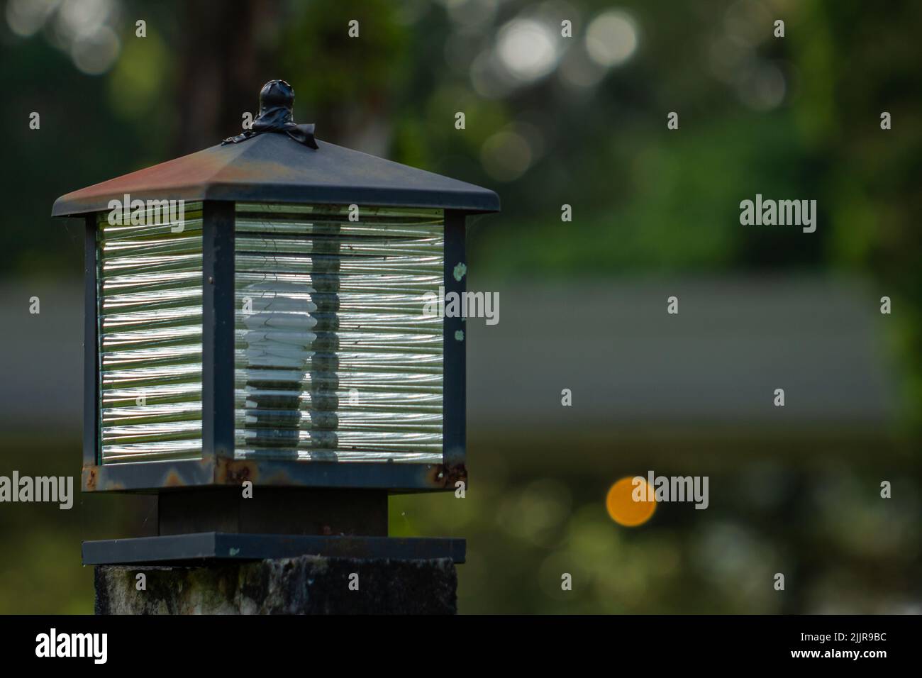 A garden lamp on the side of the road to add to the beauty as well as ...