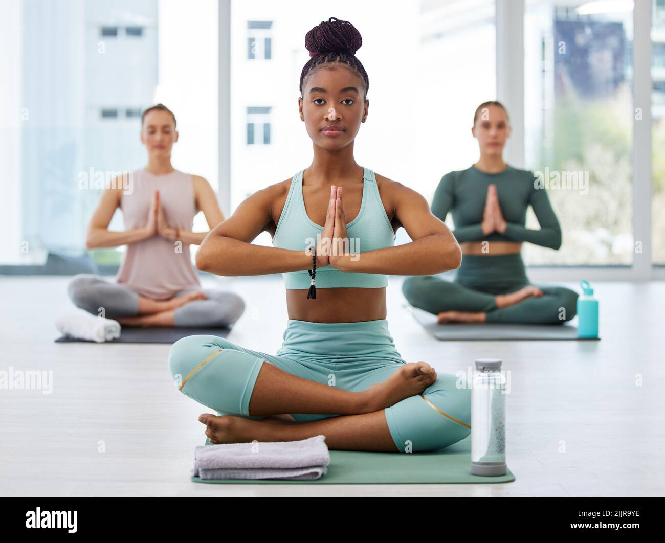 Thank yourself for your yoga practise. Full length shot of a diverse ...