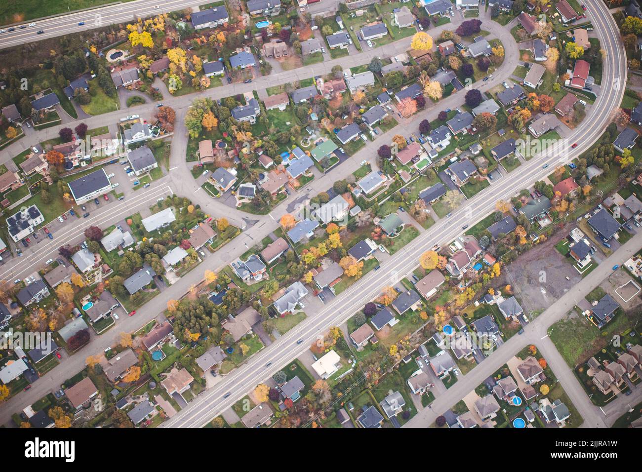 An aerial drone footage of the houses and streets of the town Stock ...
