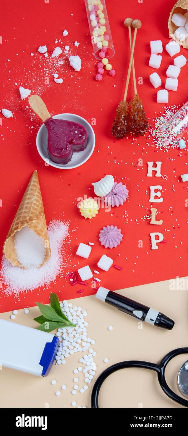 Mix of sweets and candy with sugar spread and written text in unhealthy ...