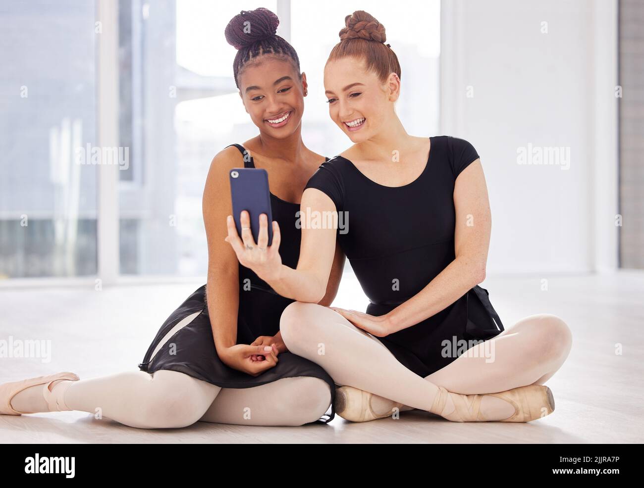 Well be best friends forever. two ballet dancers taking selfies using a ...
