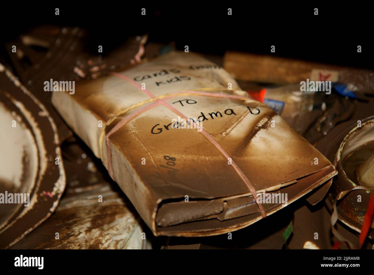 Flooded note book from a Child to their Grandma left discarded Stock ...