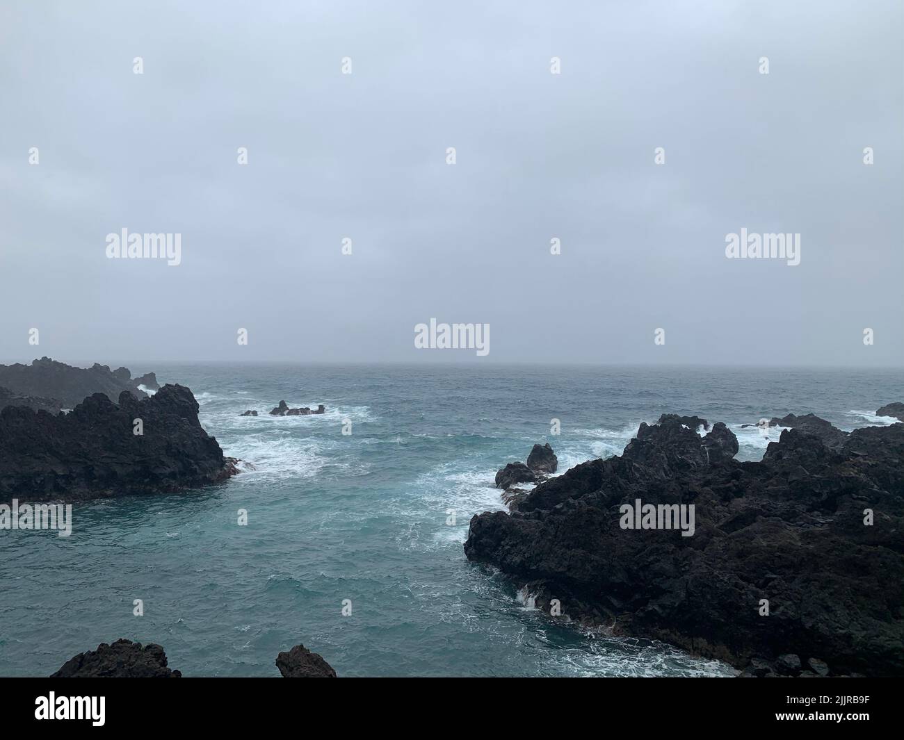 A dramatic shot of the sea during the calm before the storm in Madeira ...