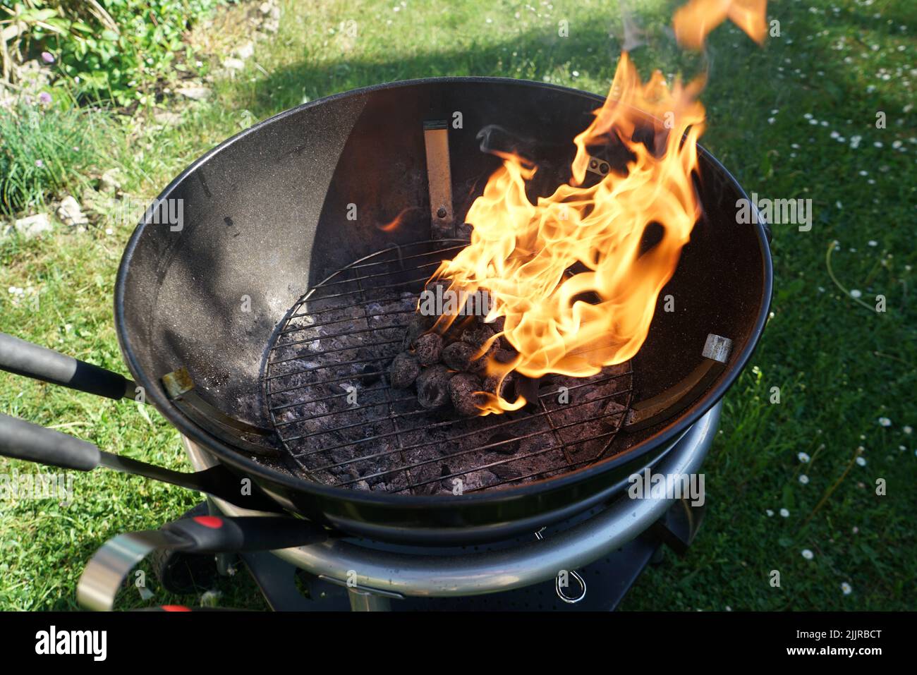 A high angle shot of fire in a barbeque grill Stock Photo - Alamy