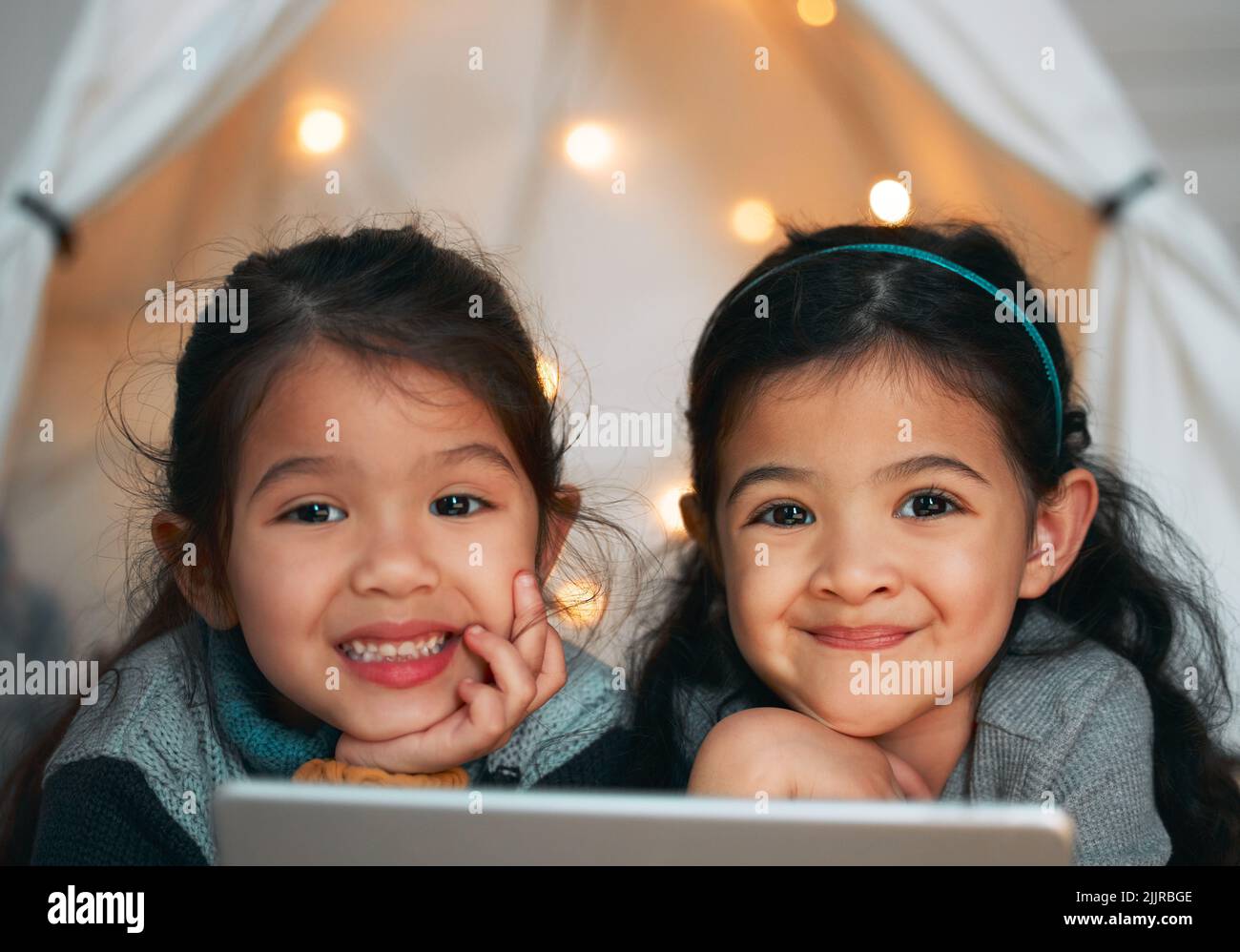 A sister is a friend wholl always have your back. two sisters using a ...