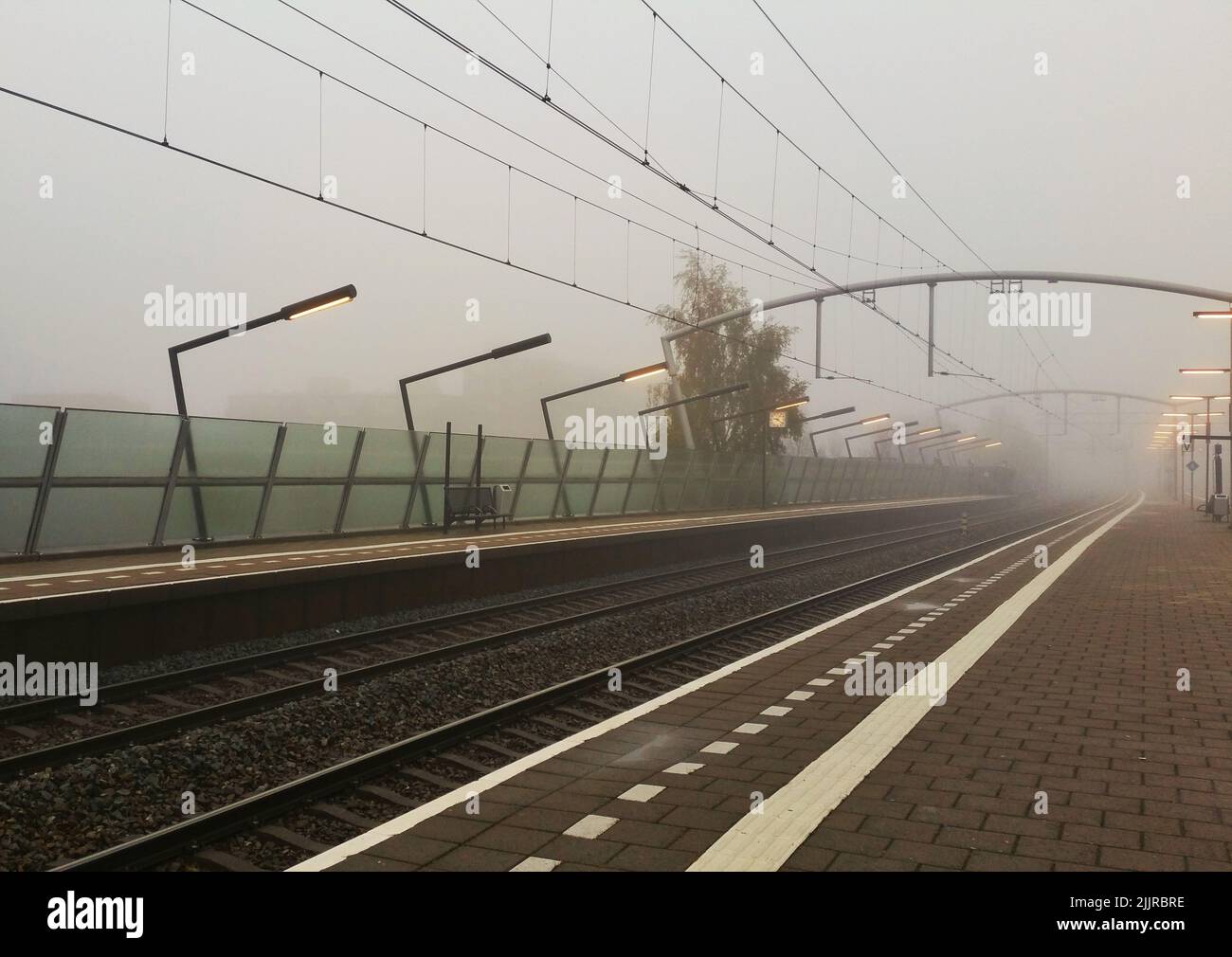 A train railway during early in the morning Stock Photo - Alamy