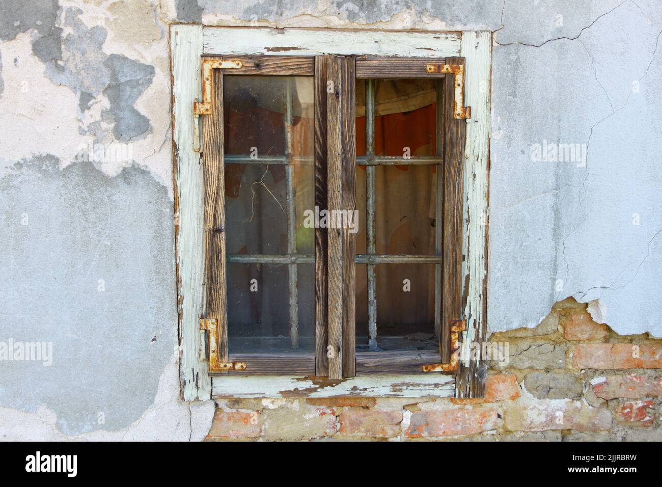 An old wooden window with broken wall tile Stock Photo - Alamy