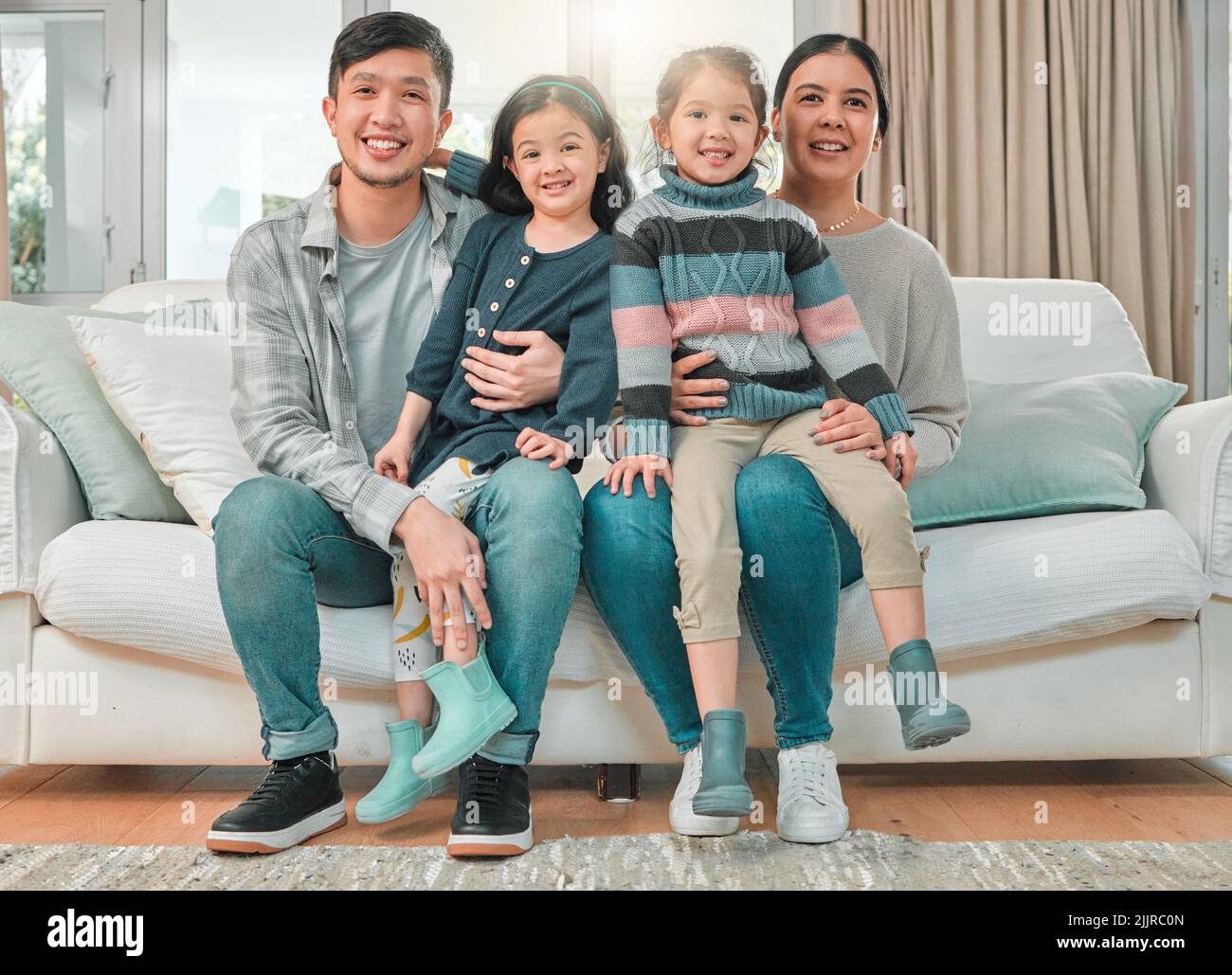 Chores does not a family day make. Portrait of a young family bonding ...