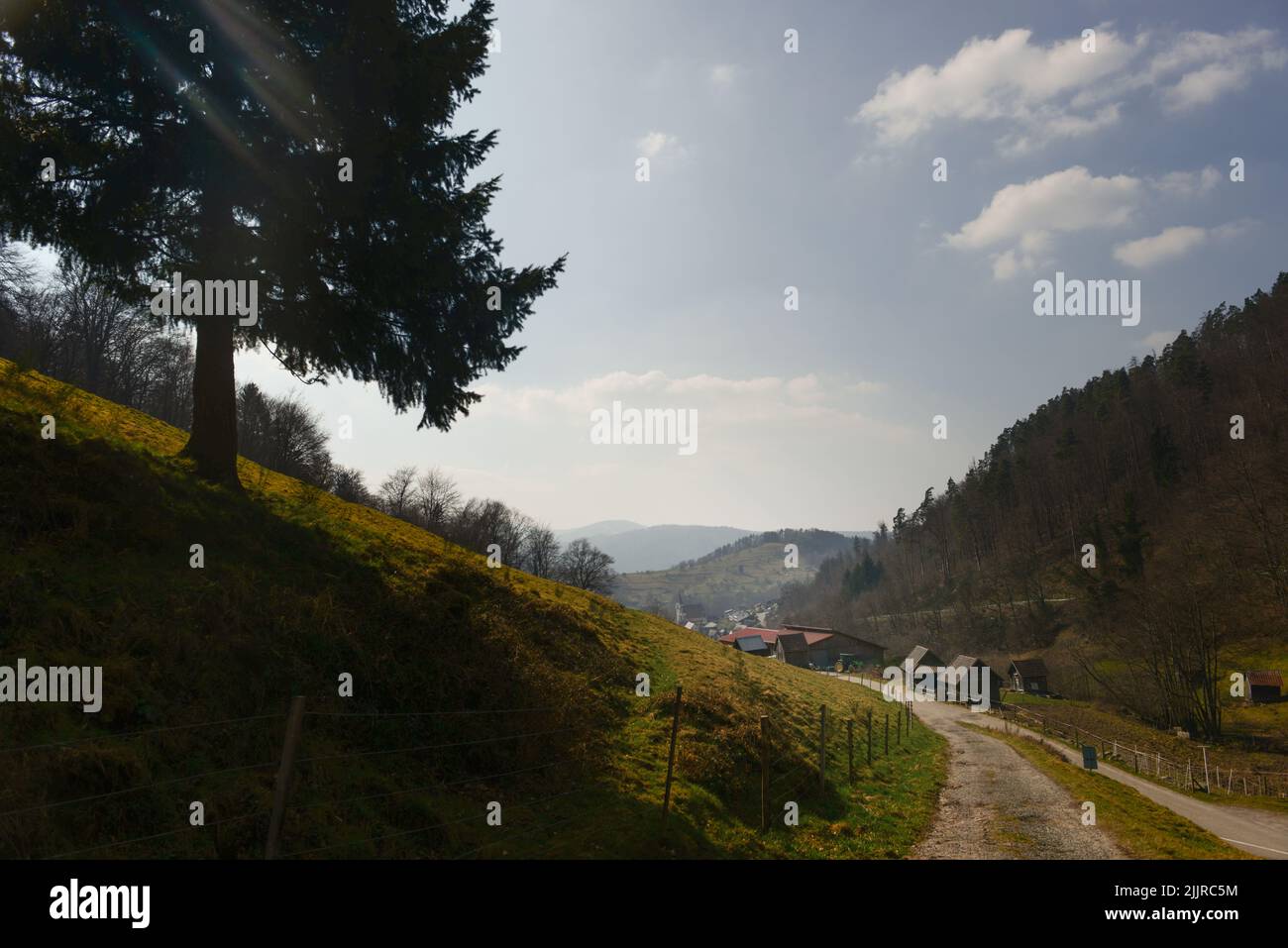 A natural landscape view of a road leading to the small town at the ...