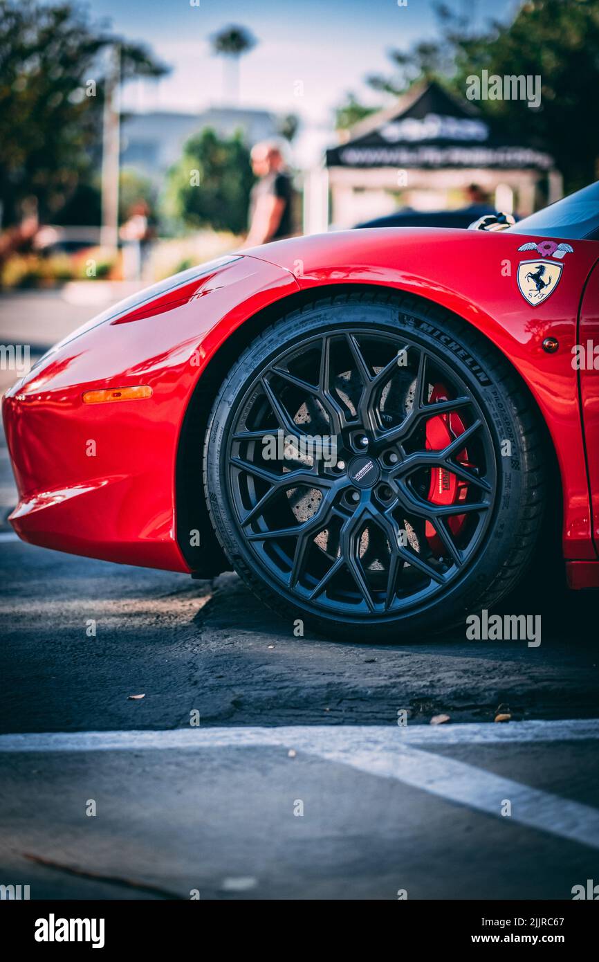 A vertical shot of a red Ferrari car rim wheel, side view Stock Photo ...