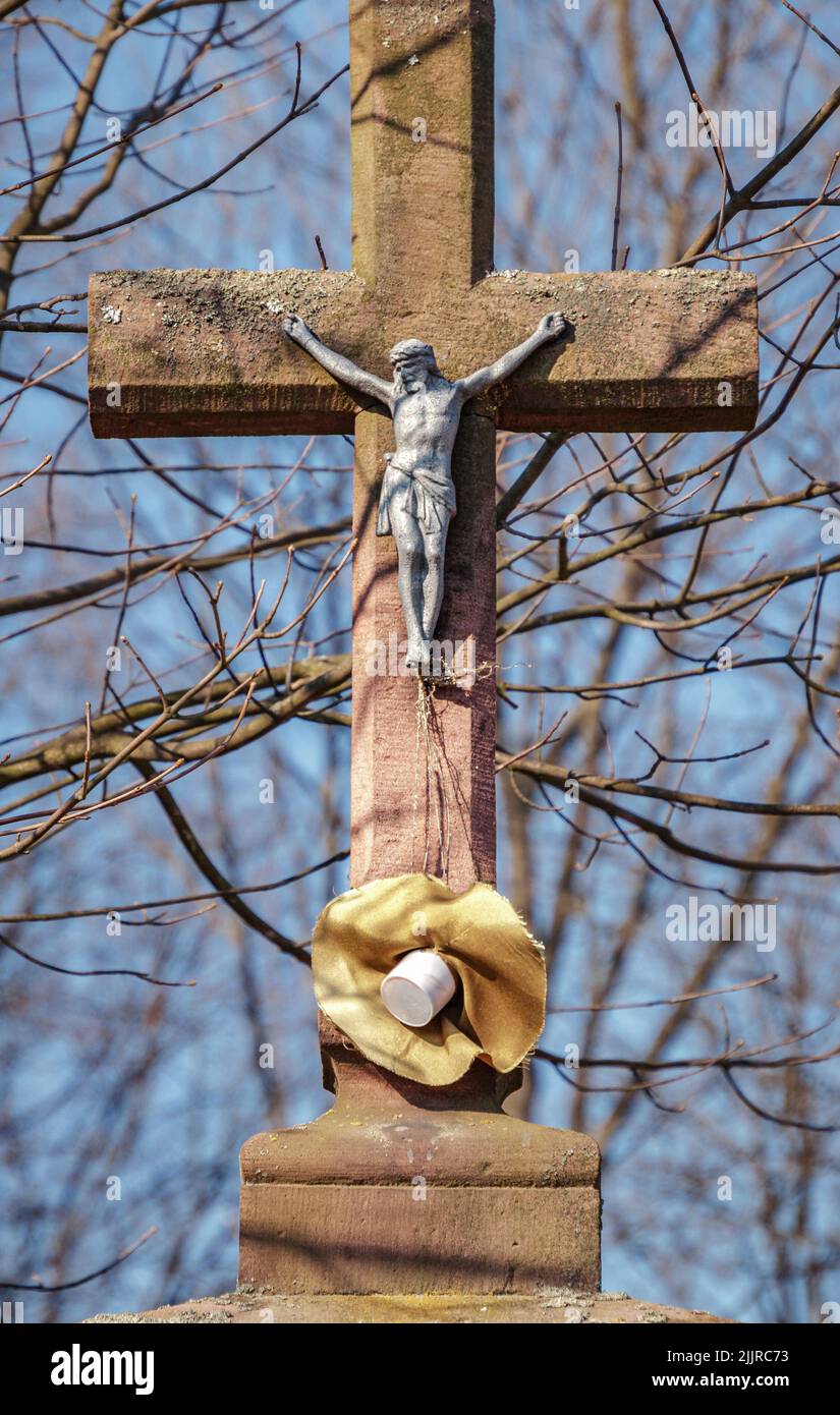 A stone cross with crucified Jesus Christ Stock Photo - Alamy
