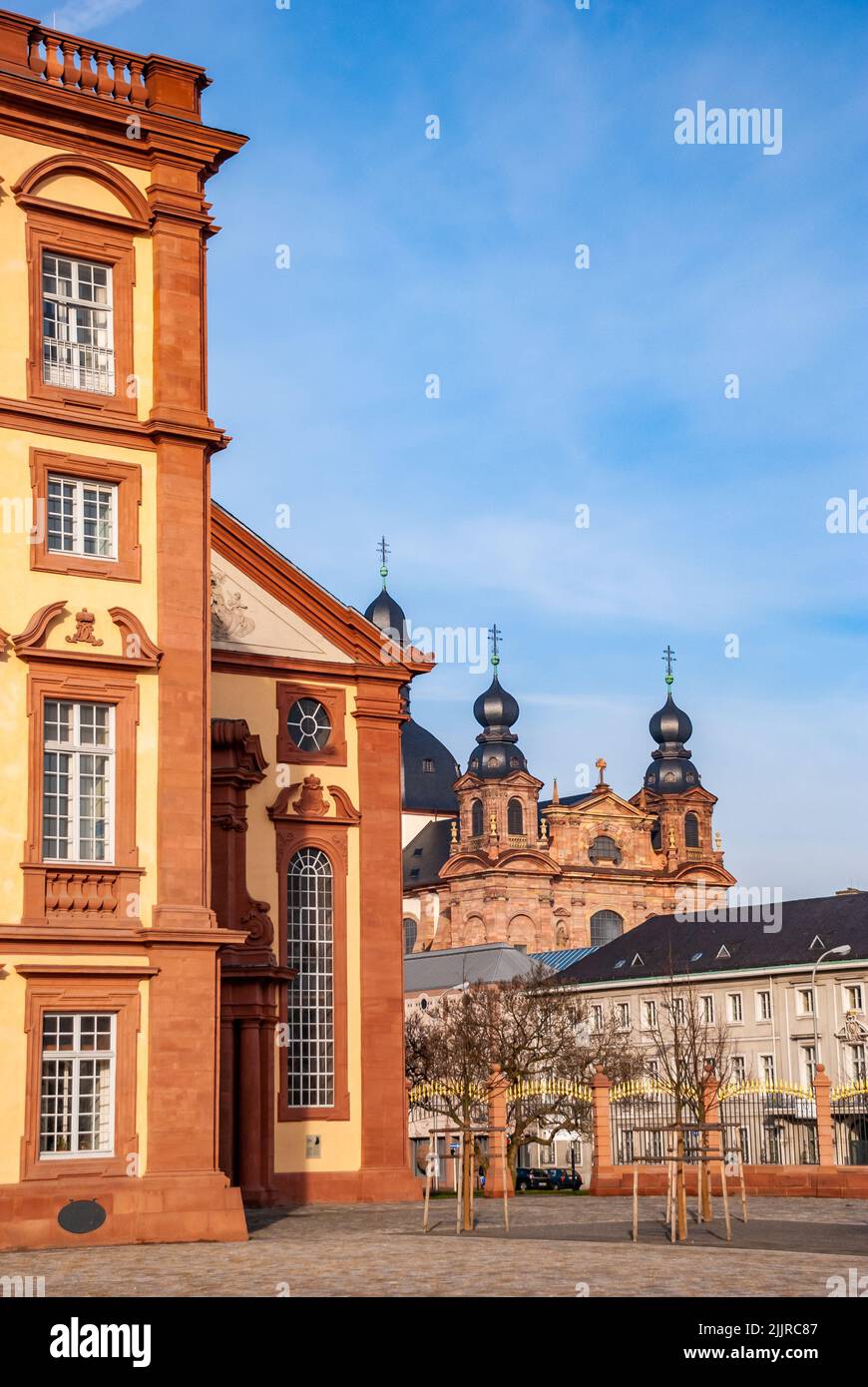 A beautiful view of the Mannheim Baroque Palace under a blue sky in ...