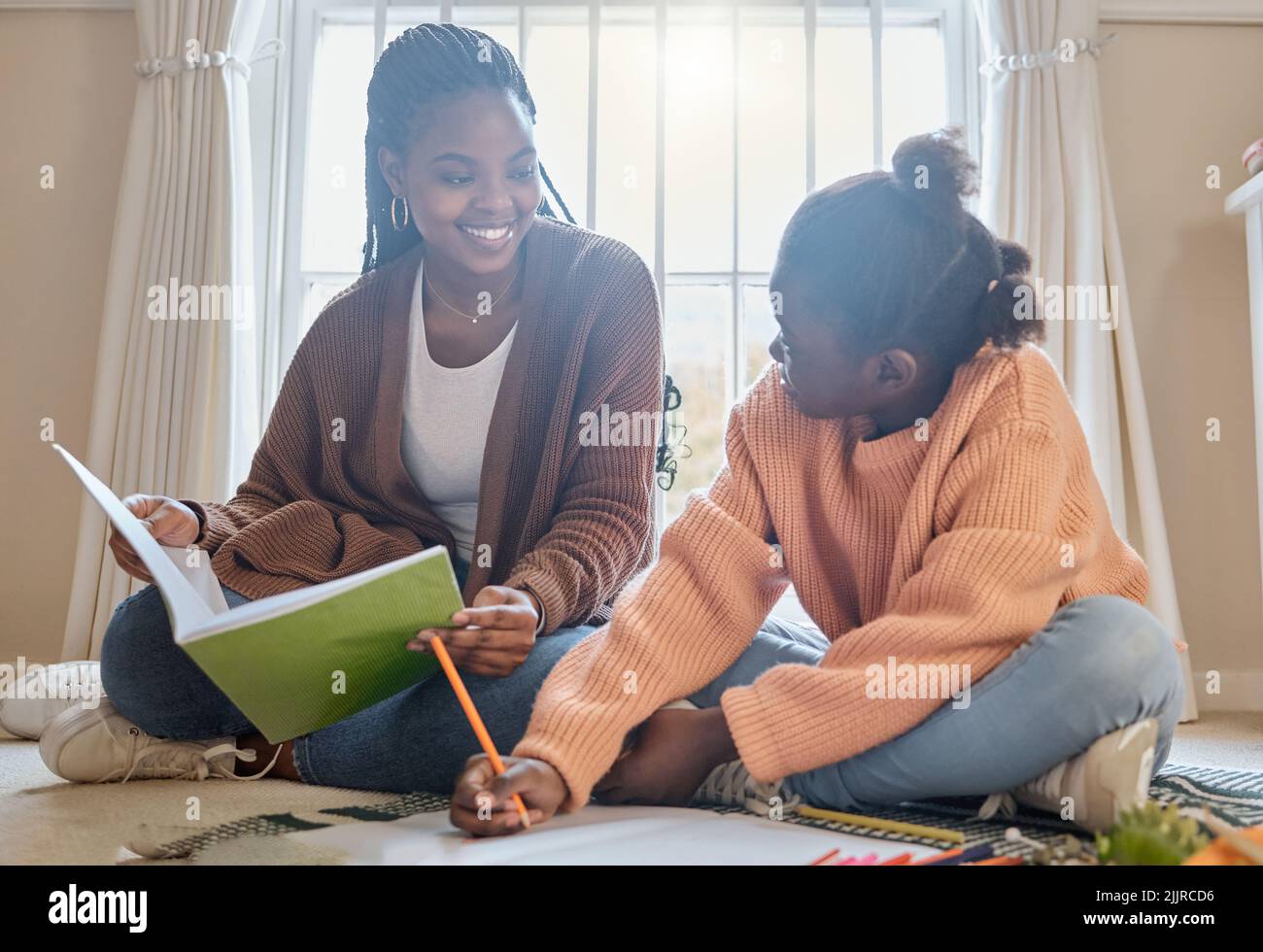 Can you do the additions. a young boy completing his homework while his ...