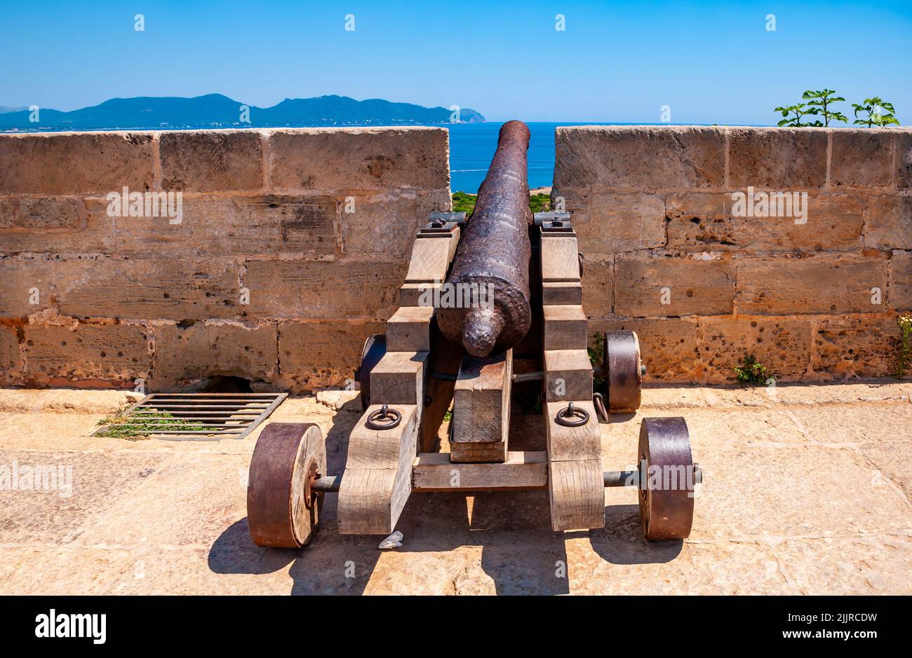 A back view of old cannon overlooking the sea in Majorca, Spain Stock ...