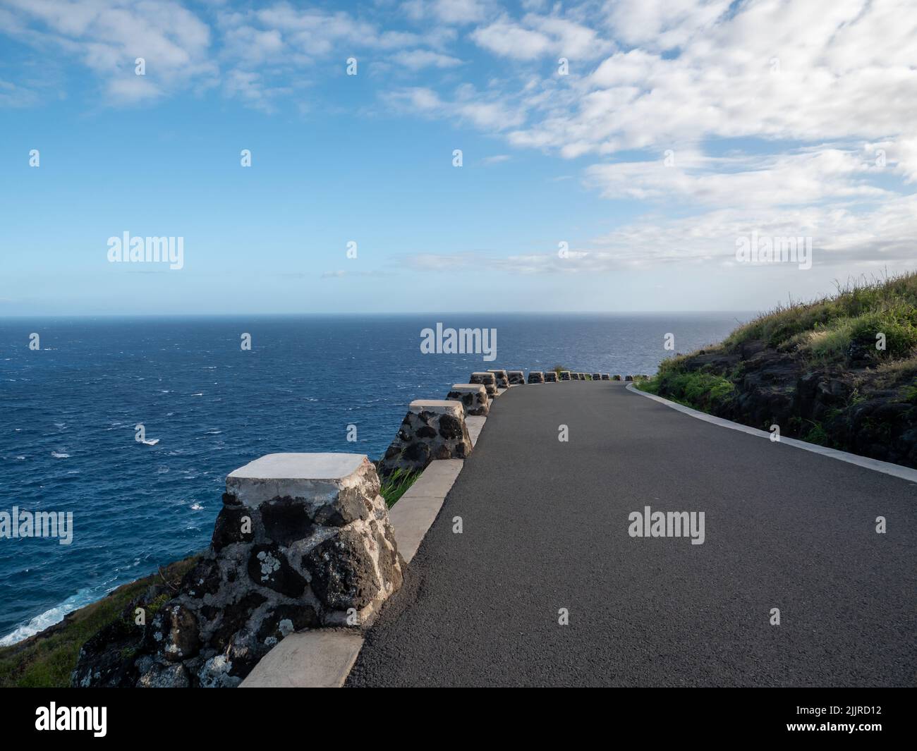 An asphalt road near the turquoise water in O' ahu South Coast, Hawaii ...