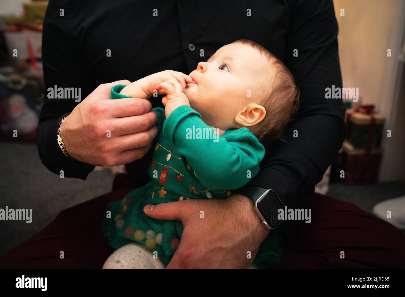 Father holding baby christmas hi-res stock photography and images - Alamy