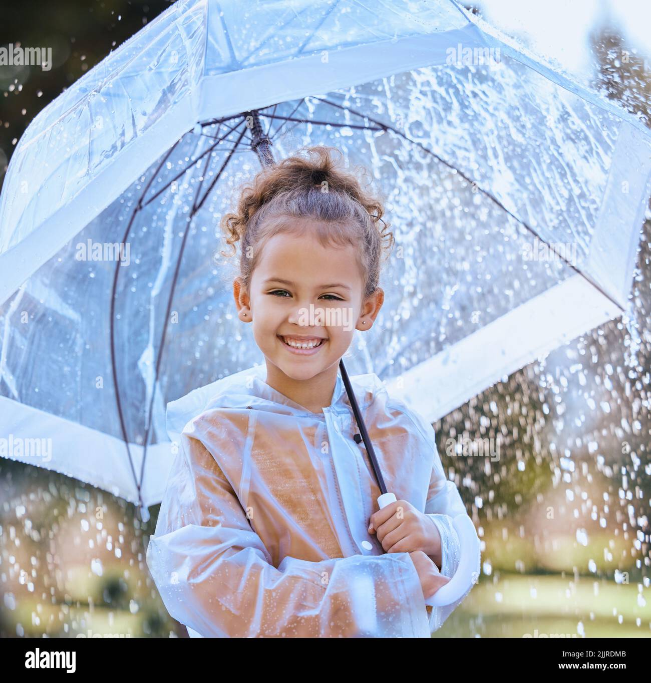 Always determined to have fun. a little girl playfully standing in the ...