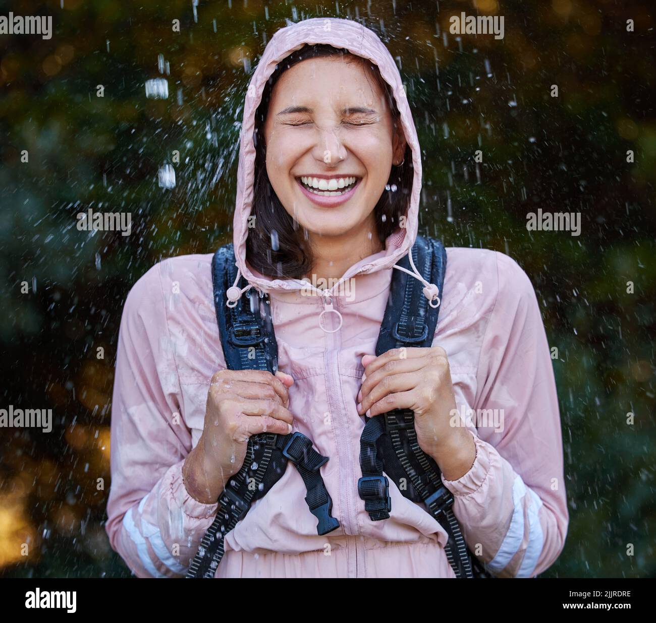 All you need sometimes is to stand in the rain. an attractive young ...